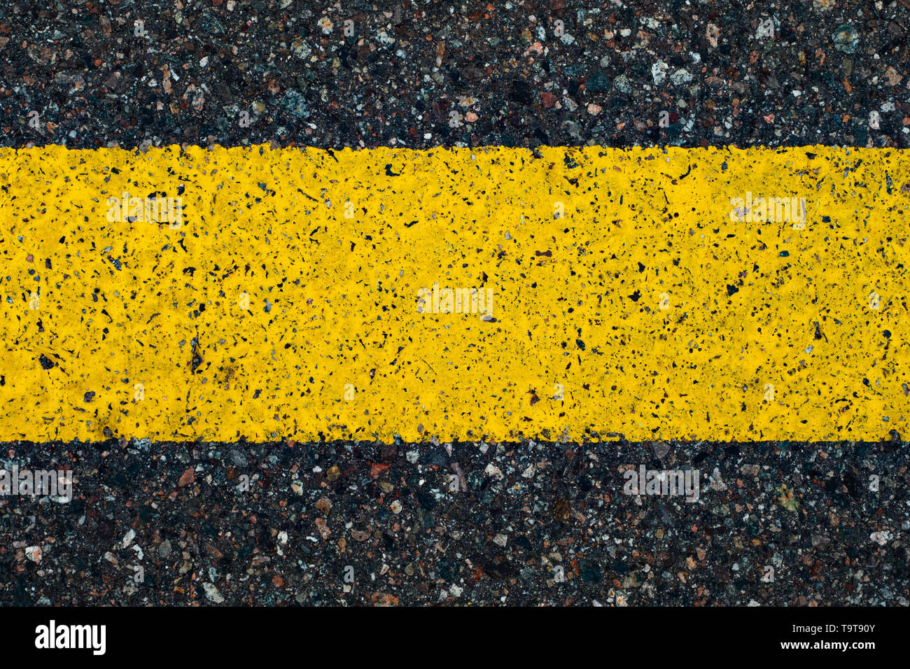 Road marking line with yellow paint on asphalt. Marking the motorway ...