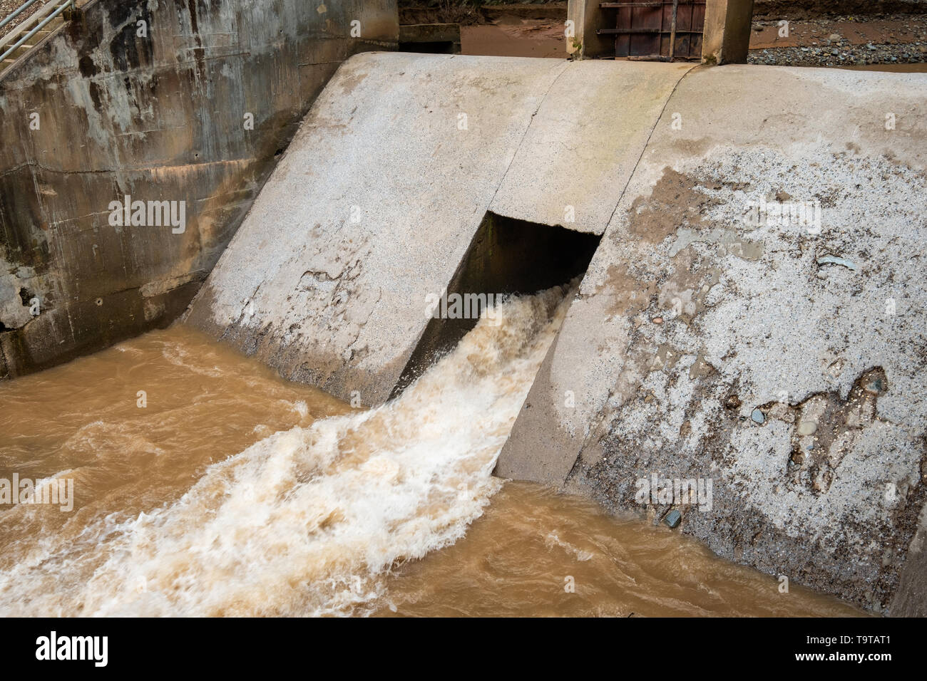 Release control of water at floodgate in countryside Stock Photo - Alamy