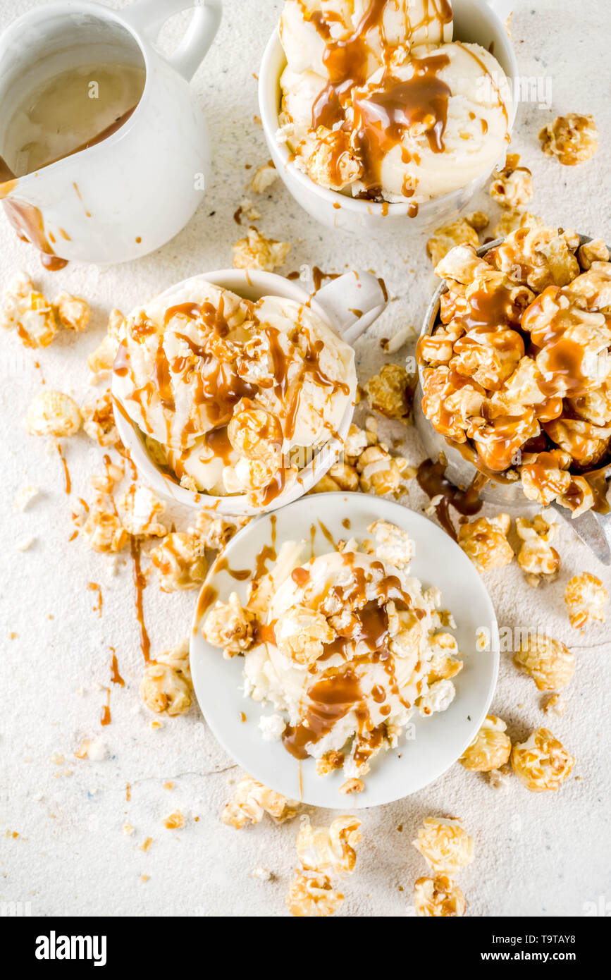 Much of homemade caramel ad pop corn ice cream, on white marble ice ...