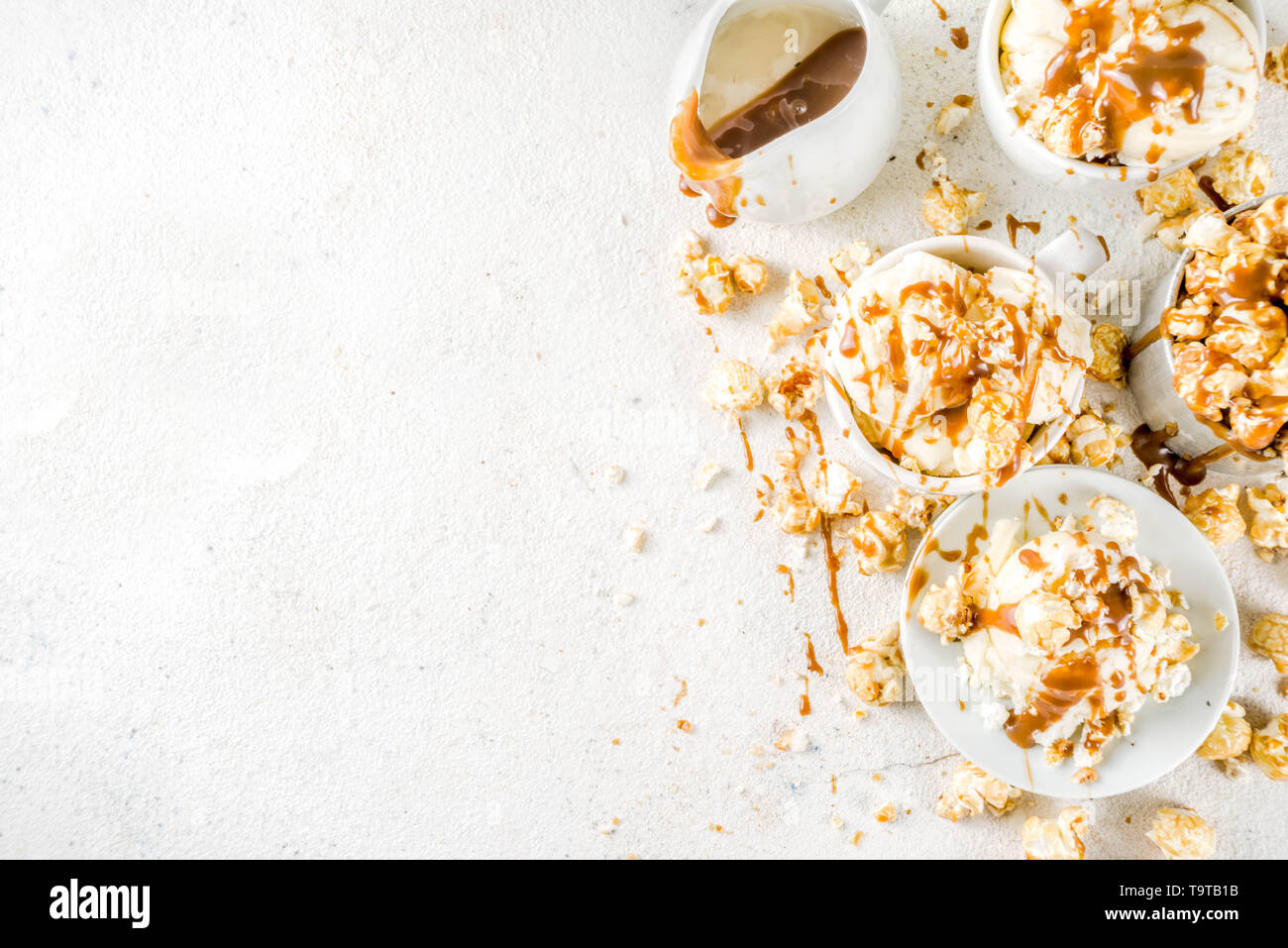 Much of homemade caramel ad pop corn ice cream, on white marble ice ...