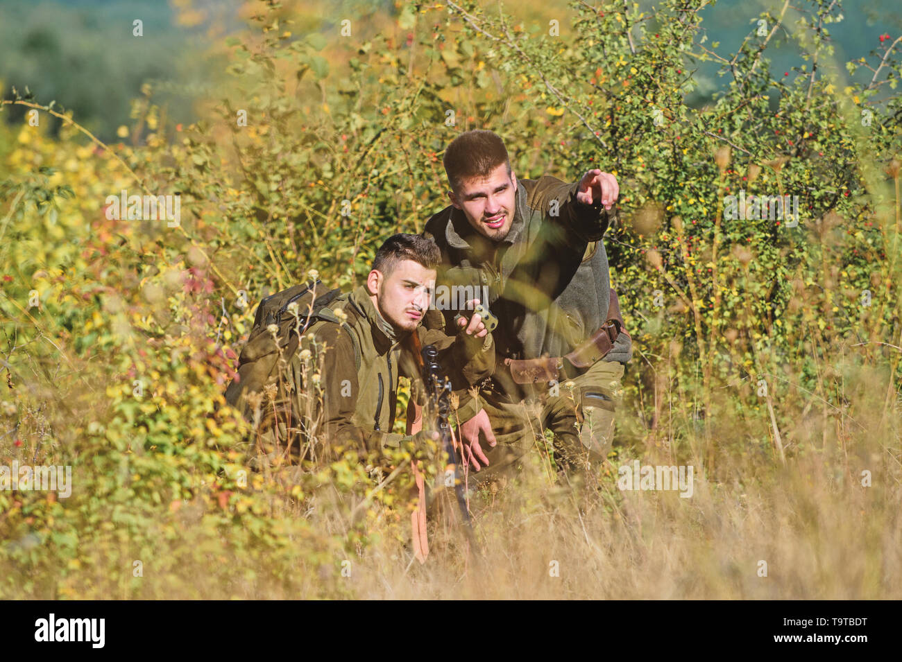 Army forces. Camouflage. Man hunters with rifle gun. Boot camp ...