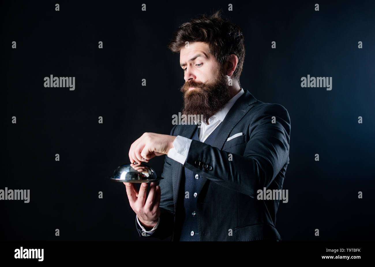 Servant carry metallic cloche. Man well groomed gentleman formal suit ...