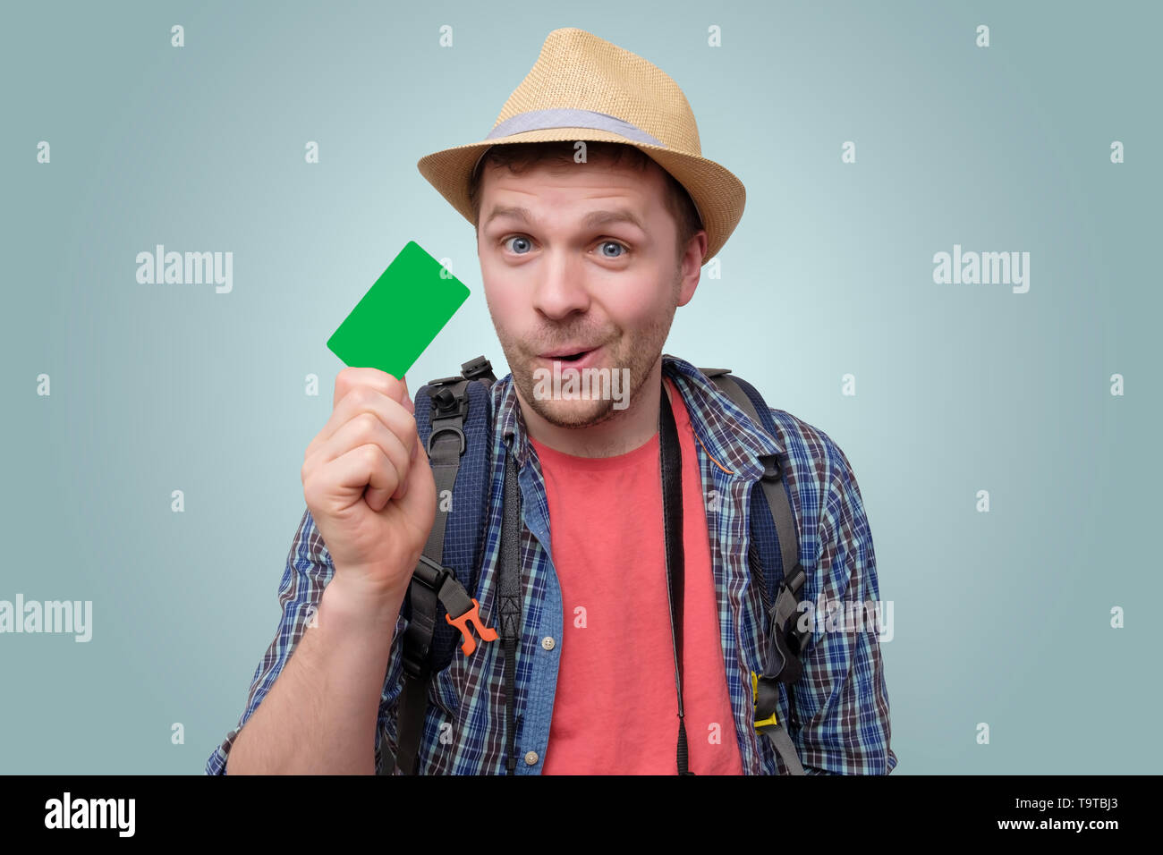 Happy man tourist holds hi-res stock photography and images - Alamy
