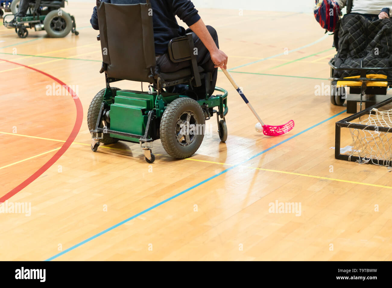 Disabled People on an electric wheelchair playing sports, powerchair ...