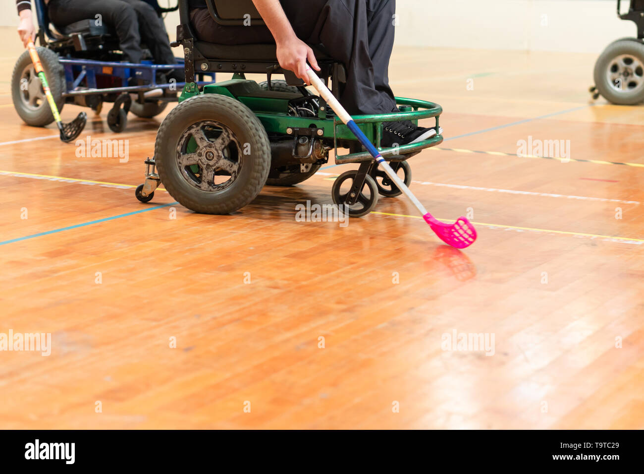 Disabled People on an electric wheelchair playing sports, powerchair ...