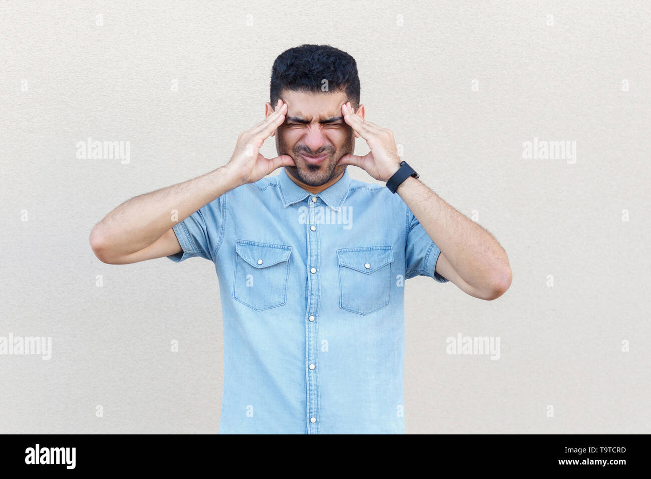 headache, confusion or problem. Portrait of sick handsome young bearded ...