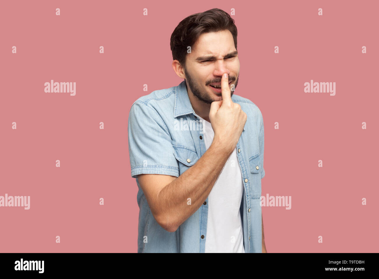 You are liar. Portrait of angry handsome bearded young man in blue ...