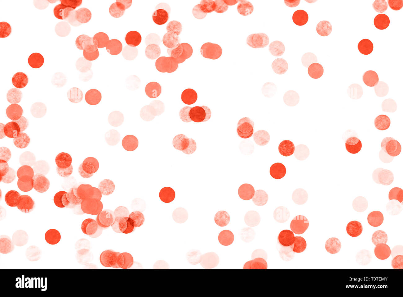 Bright coral confetti isolated on white background Stock Photo - Alamy