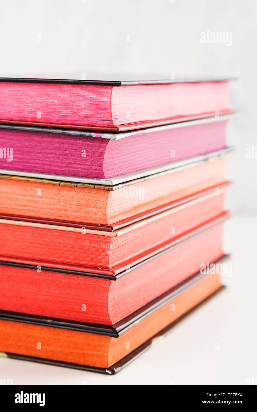 Pile of books with color stack on white background Stock Photo - Alamy