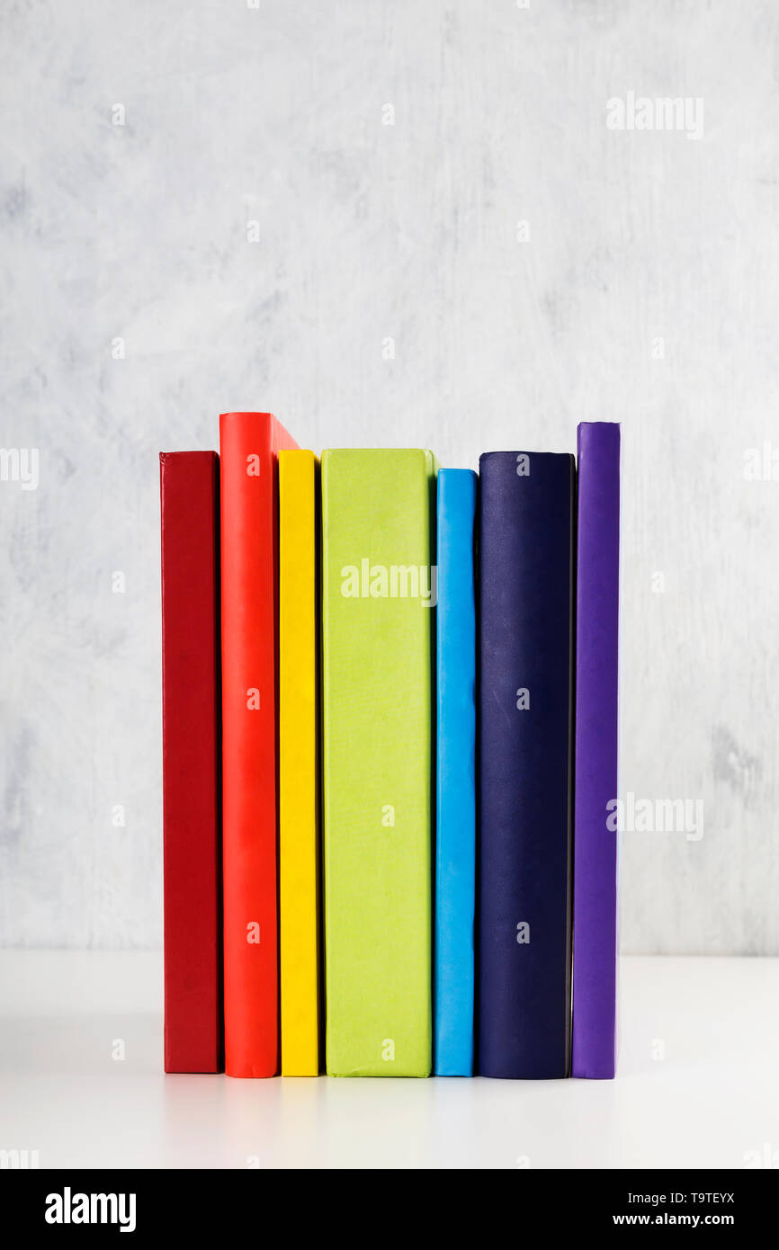Stack of colorful rainbow books on white background Stock Photo - Alamy