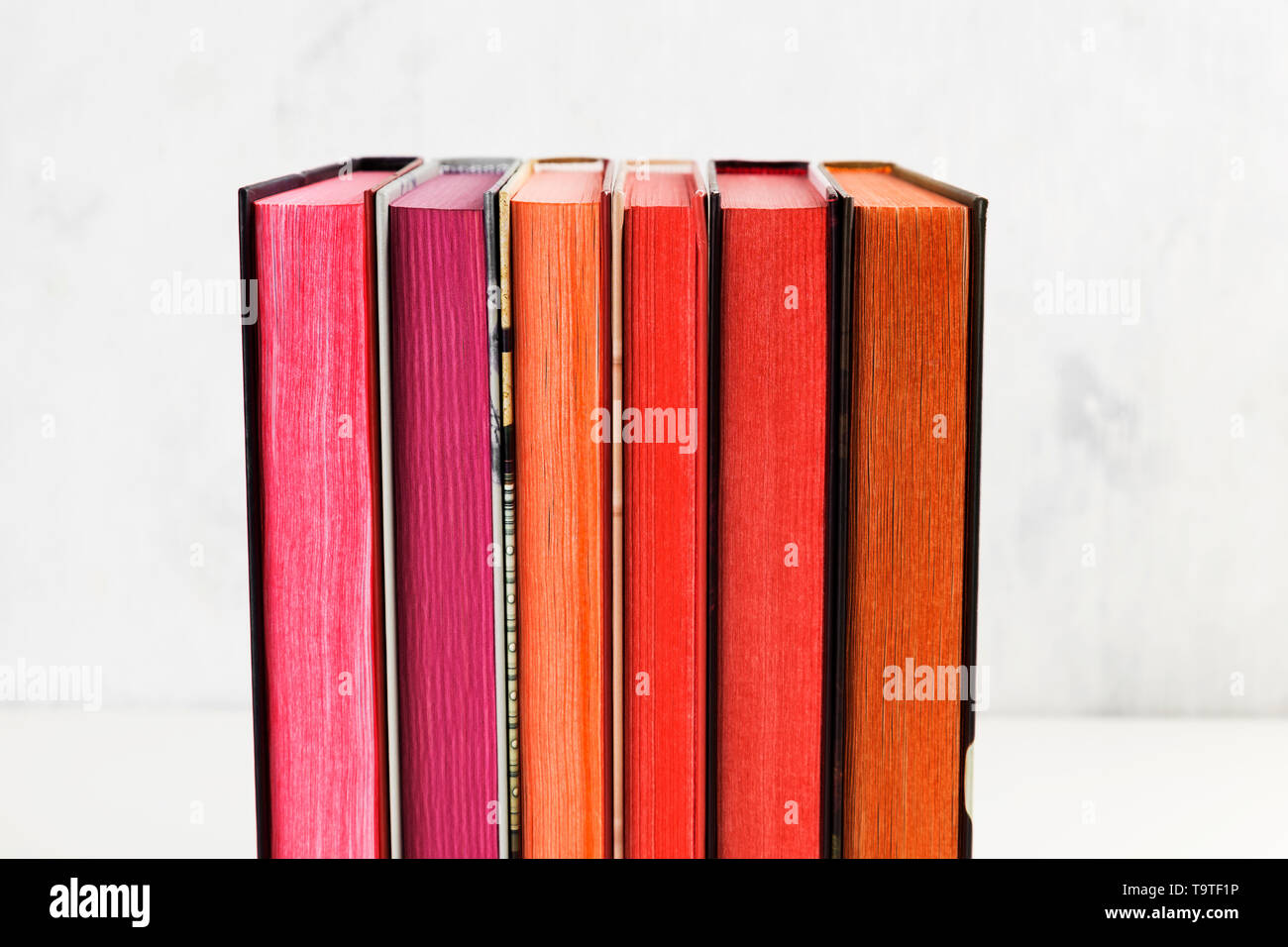 Pile of books with color stack on white background Stock Photo - Alamy