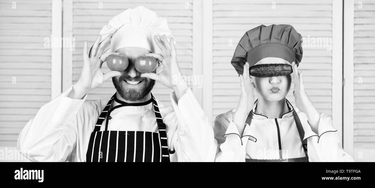 Providing amounts of vitamin. Senior chef and kitchen maid holding ...