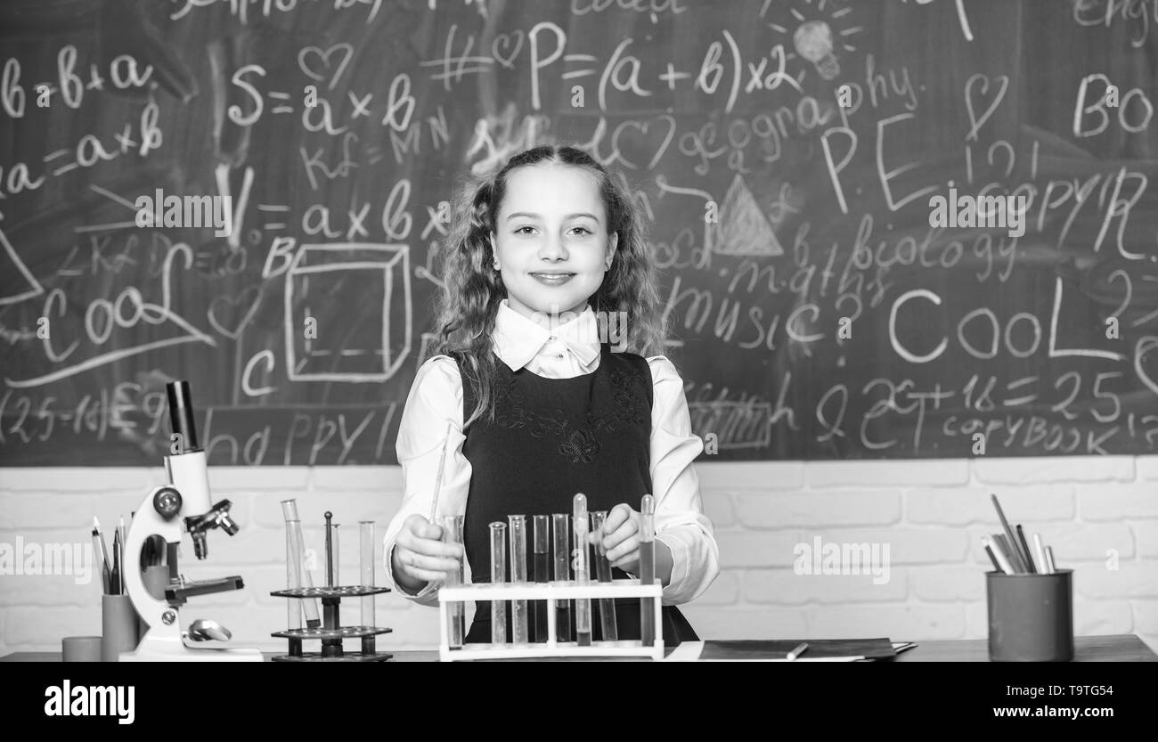 Lab microscope. She has brilliant scientific mind. Chemistry microscope ...