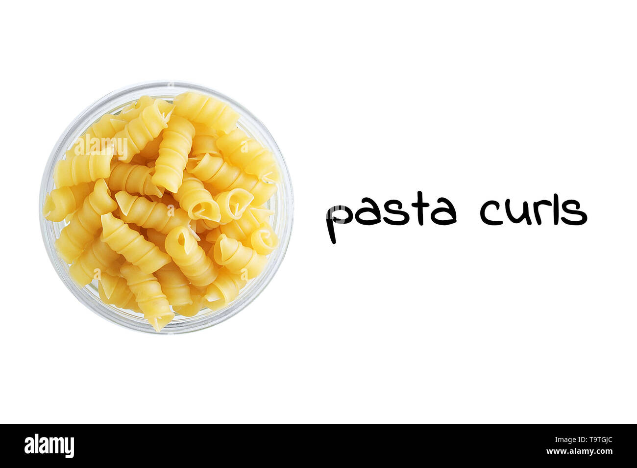 Paste curls in a glass bowl. View from above. White isolate Stock Photo ...