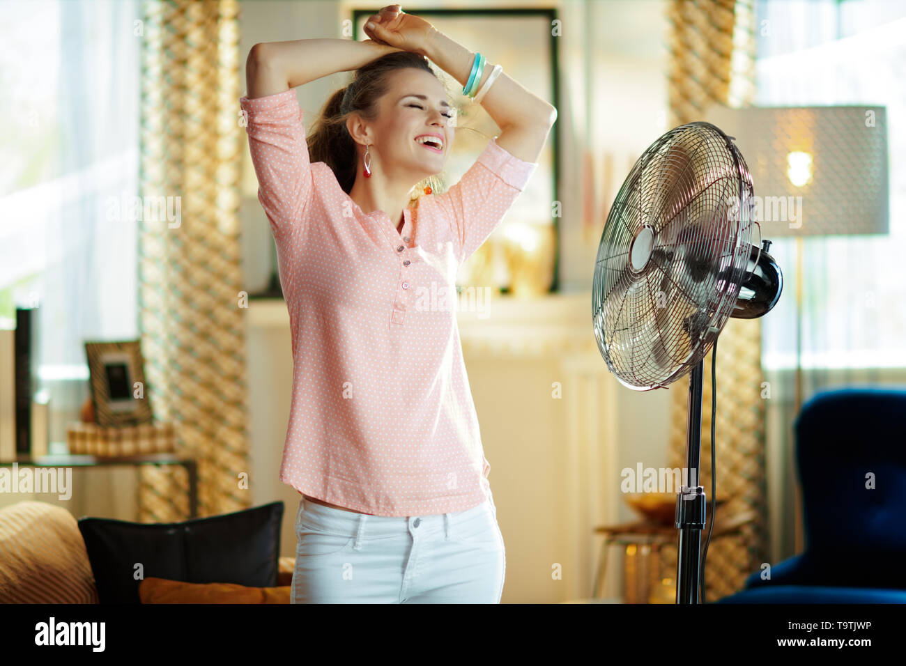Too hot woman sweating fan hi-res stock photography and images - Alamy