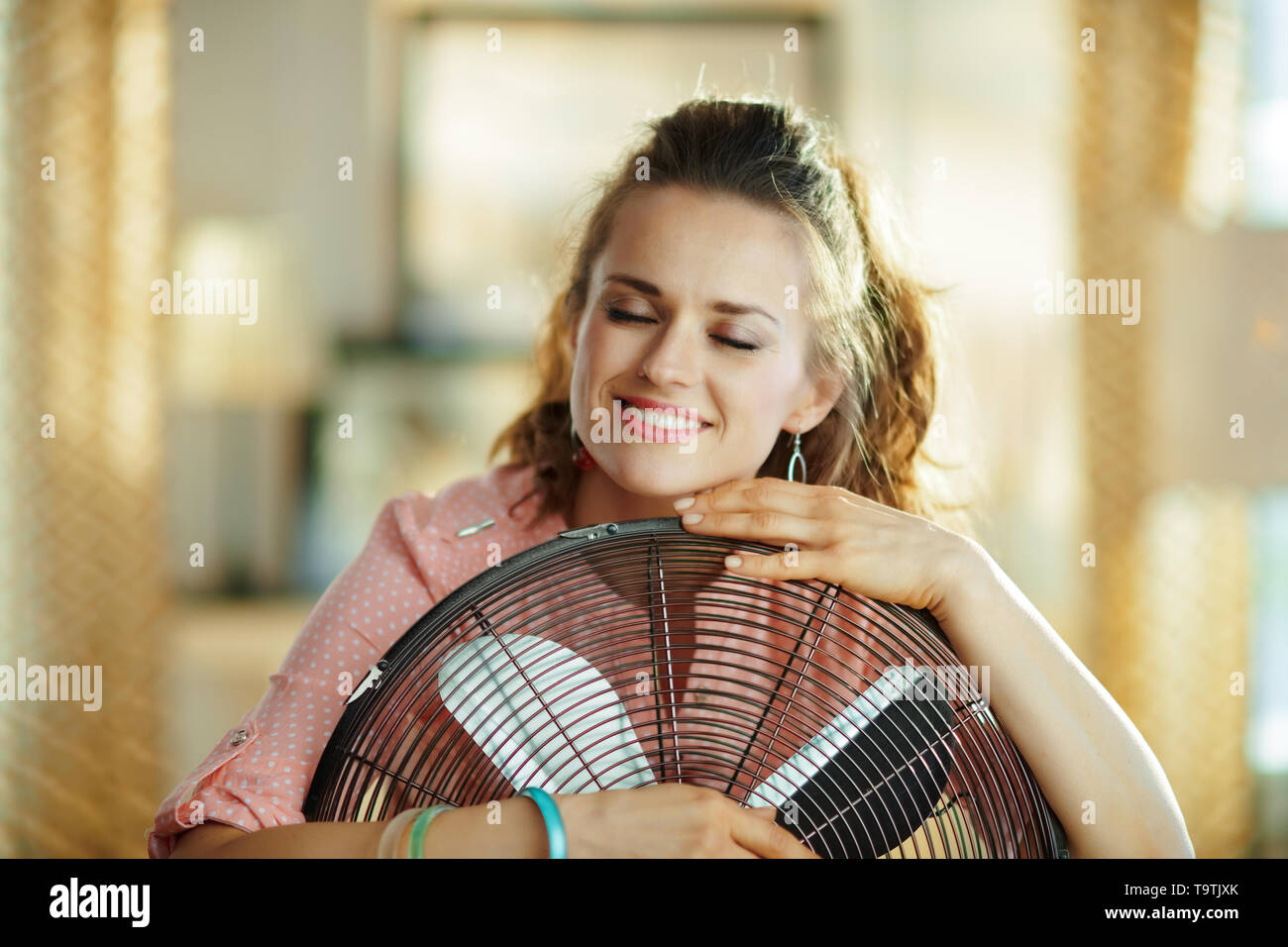 Too hot woman sweating fan hi-res stock photography and images - Alamy