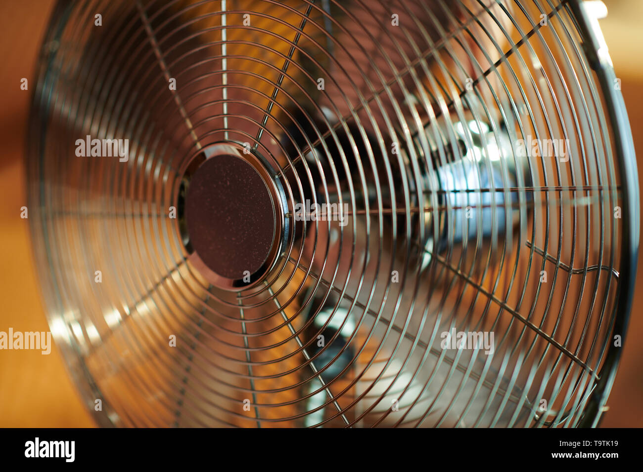 Closeup on working metallic floor standing fan in the modern house in ...