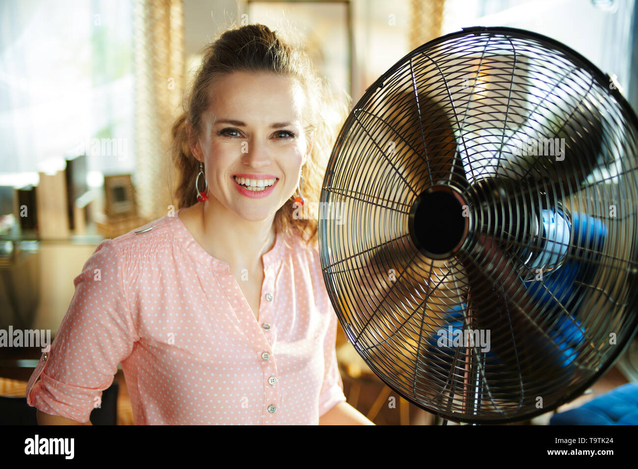 Woman cooling down fan hi-res stock photography and images - Alamy