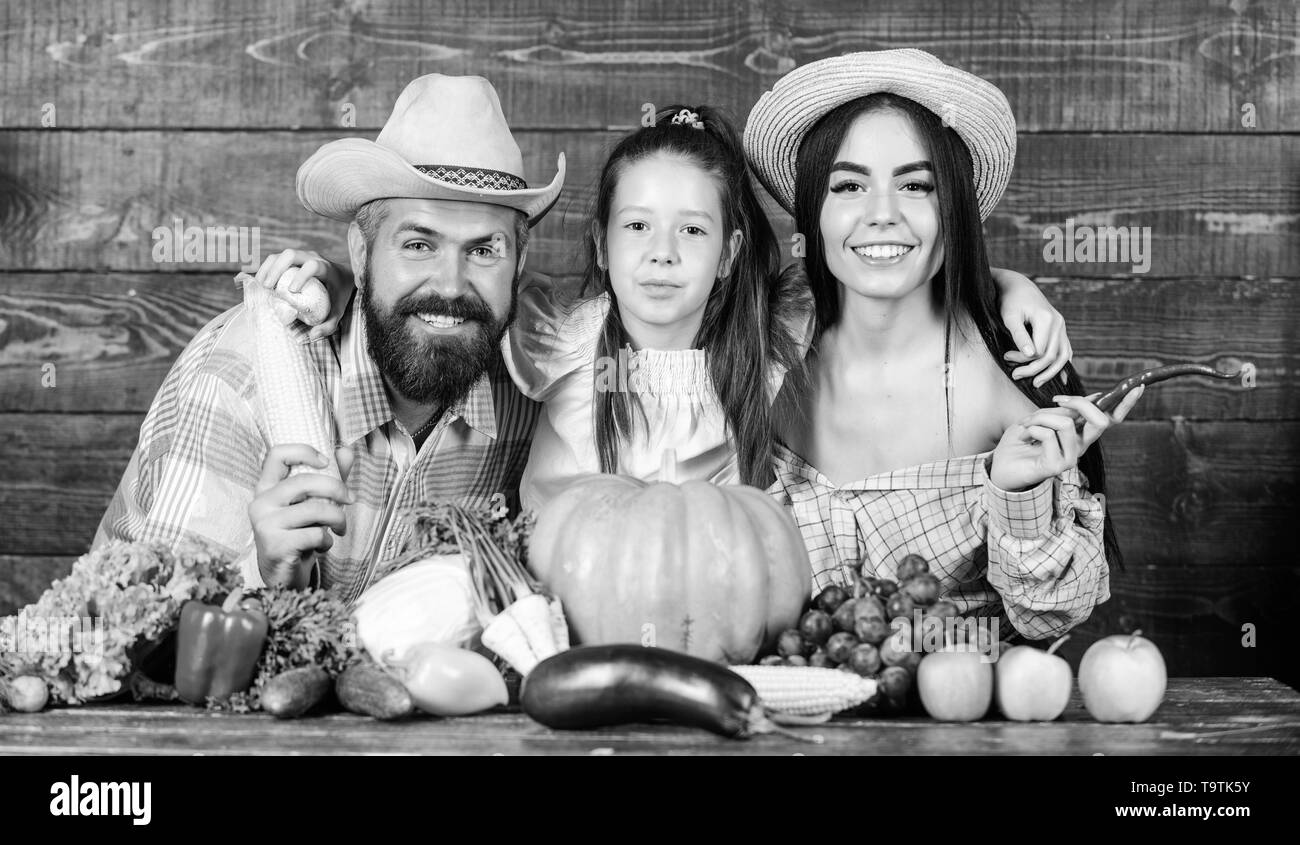 Family farmers with harvest wooden background. Family rustic style ...