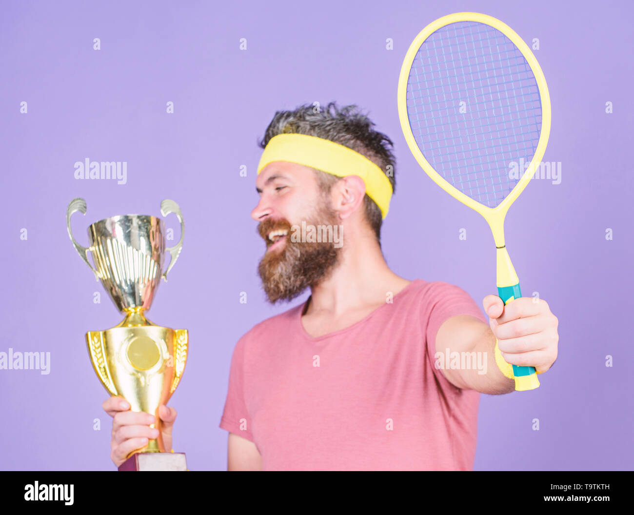 Athlete hold tennis racket and golden goblet. Win tennis game. Man ...