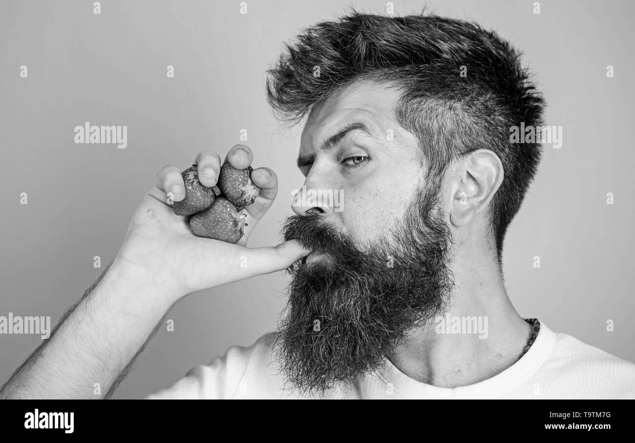 Man strict face enjoy fresh drink strawberry juice. Fresh juice concept ...