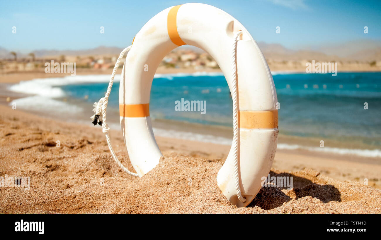 Beautiful landscape of sandy sea beach and white plastic life saving ...