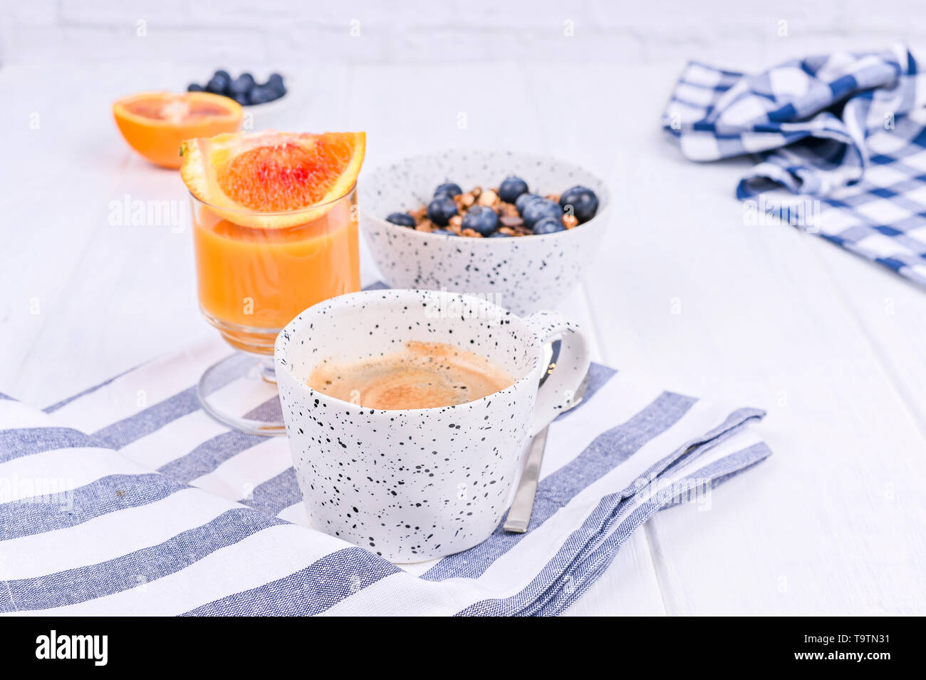 Traditional european breakfast on white wooden background. Muesli with ...