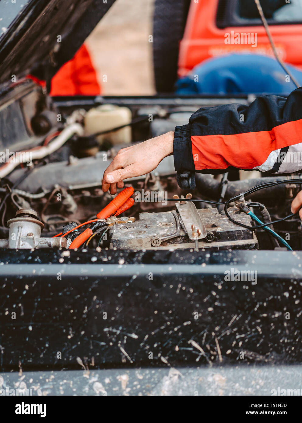 Jump-Starting the Dead Battery using jumper electrical wires Stock ...
