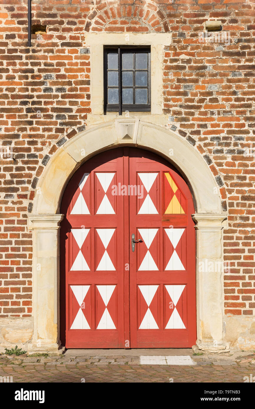 Red door of the historic castle in Raesfeld, Germany Stock Photo - Alamy