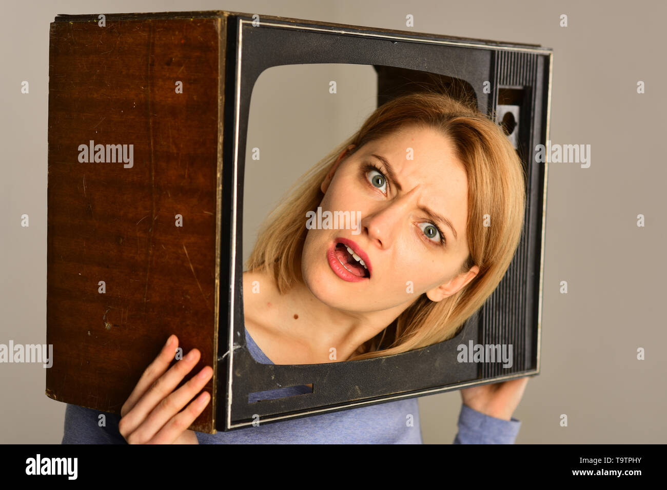 television. television channel concept. woman looking from television ...