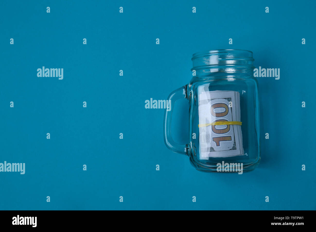Mason jar with money on color background. Savings concept Stock Photo ...
