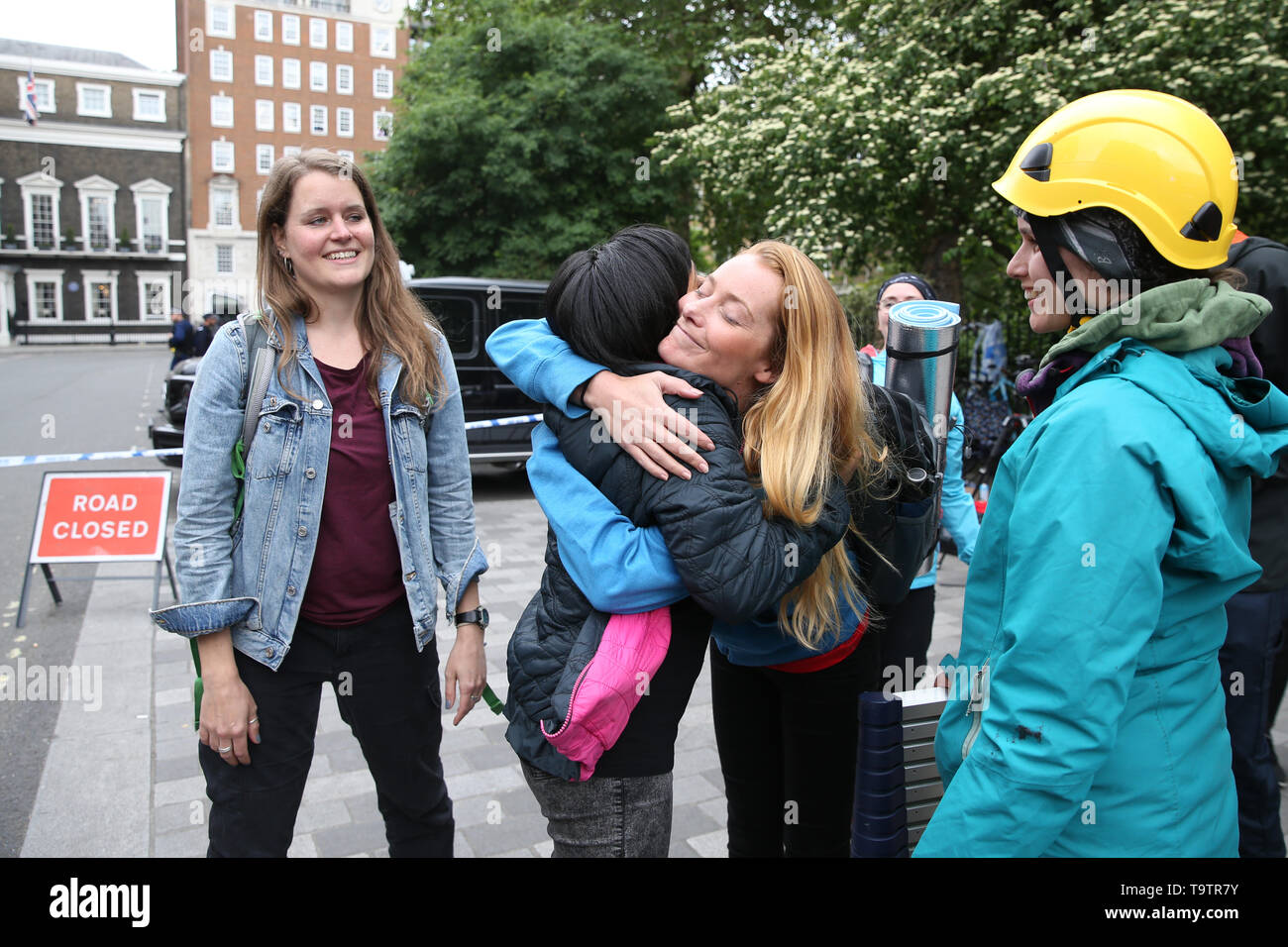 Greenpeace activists hug after leaving the police corden. The ...
