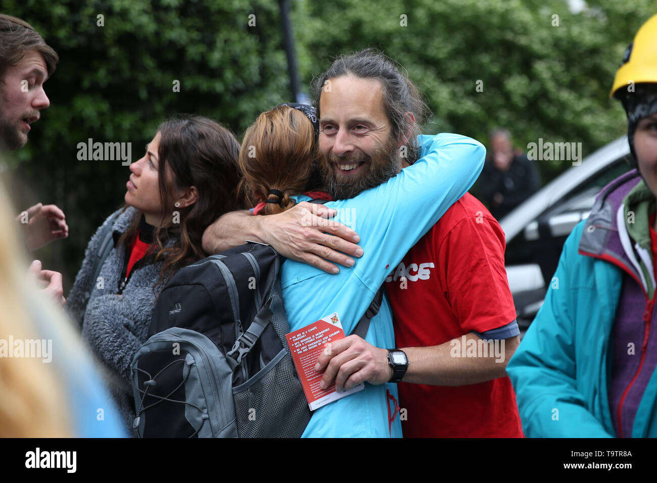 Greenpeace activists hug after leaving the police corden. The ...