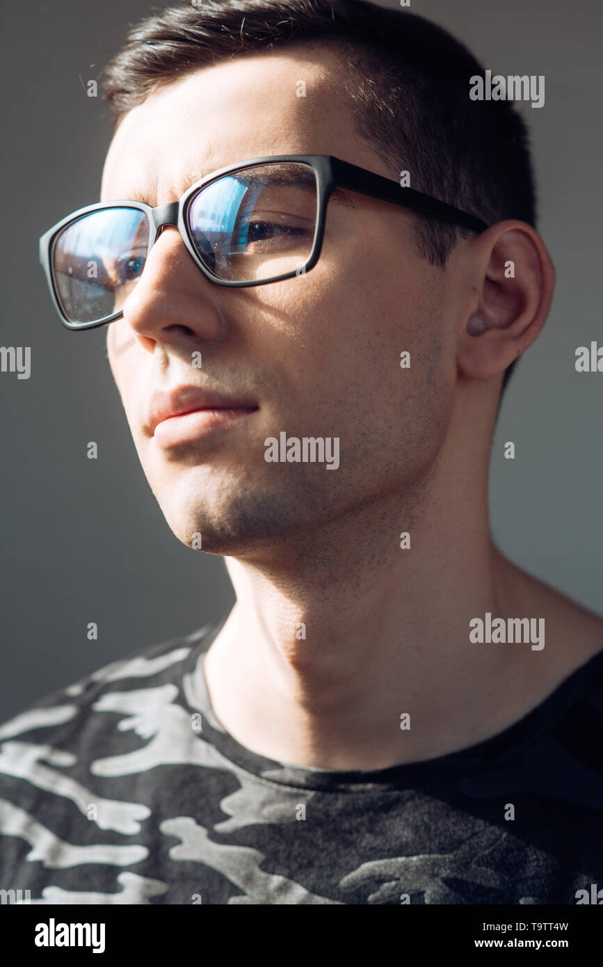 poor eyesight. poor eyesight correction of man in glasses Stock Photo ...