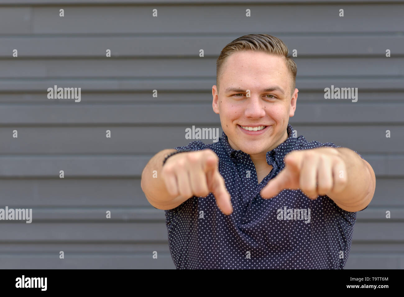 Person smiling gesturing hands hi-res stock photography and images - Alamy