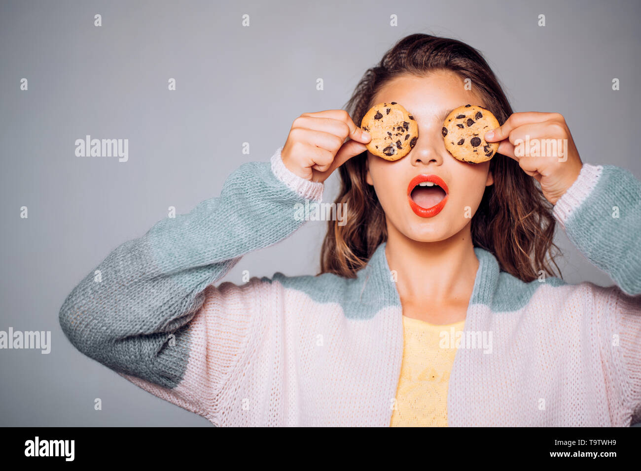 The cookies are so fun and simple. Pretty girl covering eyes with ...