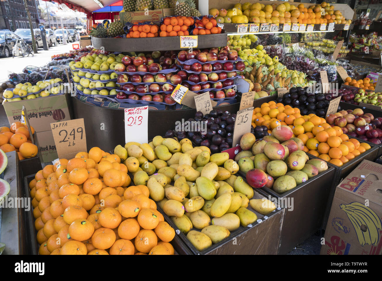 Variety of fruits on display outdoors along the sidewalk on Church ...
