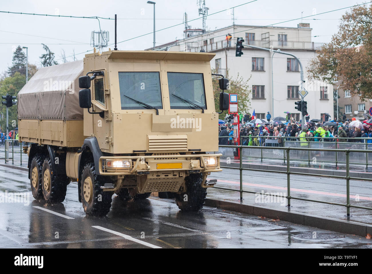 Soldiers of Czech Army are riding military vehicle with armored cab on ...