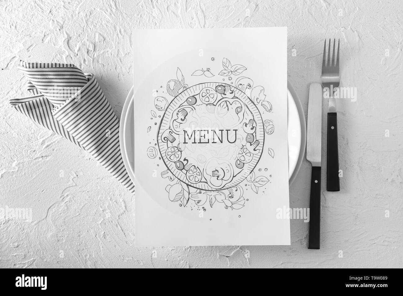 Menu on served table in restaurant Stock Photo - Alamy