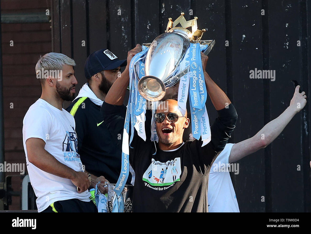 Manchester City's Vincent Kompany lifts the Premier League trophy ...