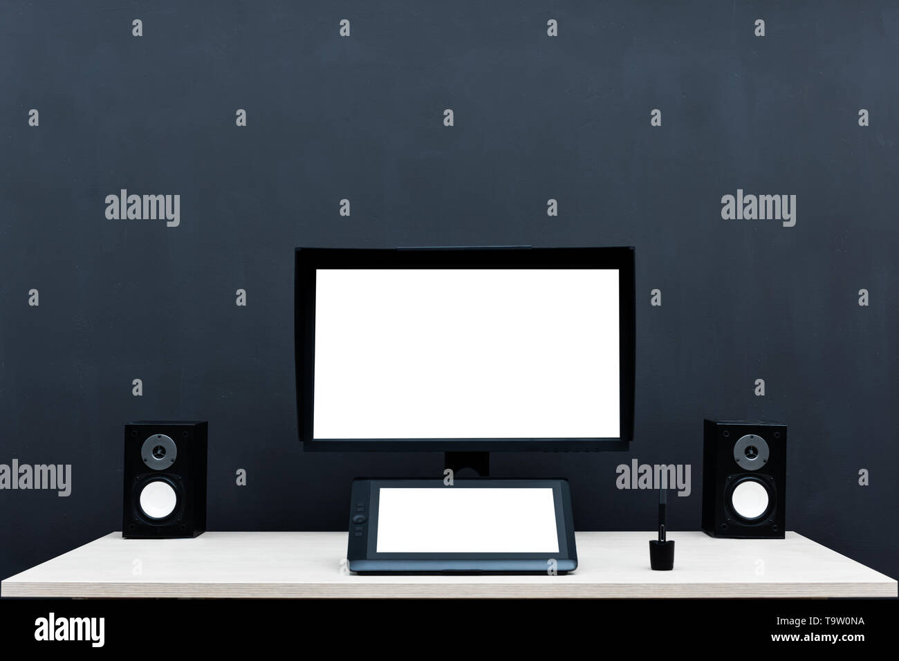 Pc computer and graphic tablet on workspace table showing blank white ...