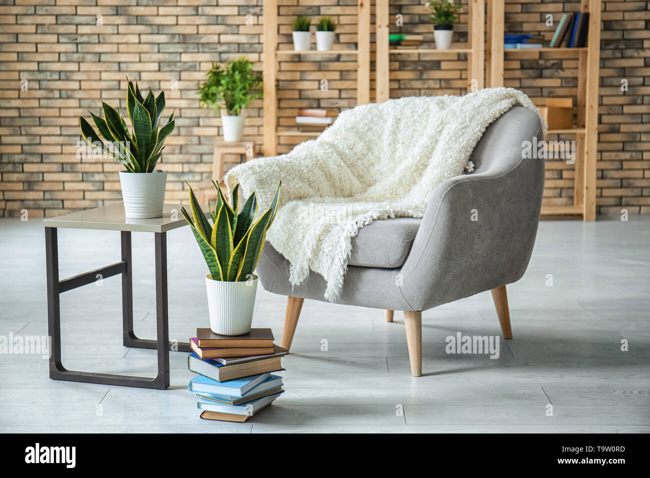 Interior of modern room with comfortable armchair Stock Photo - Alamy