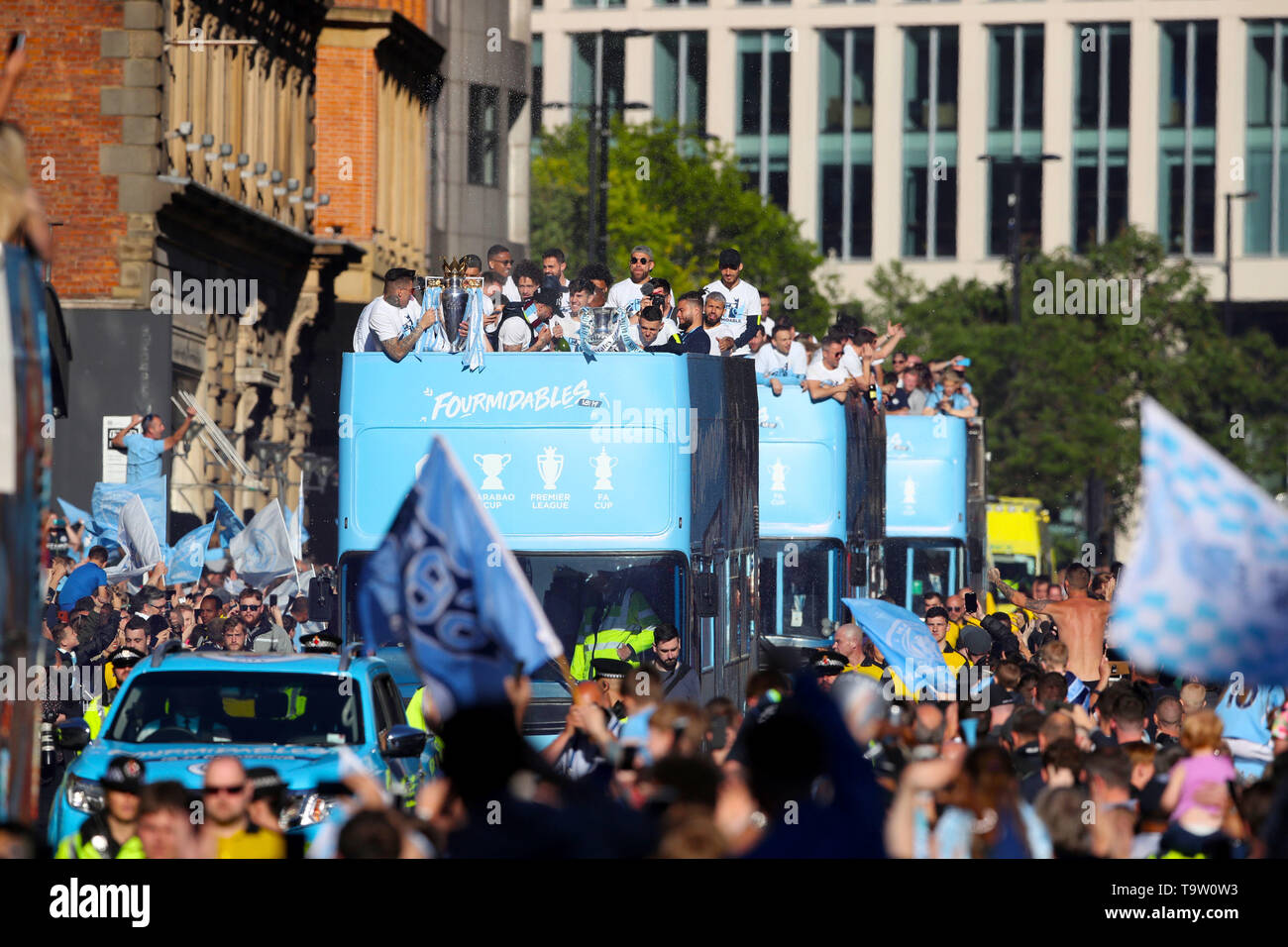 Manchester City Players and staff on the buses during the trophy parade ...