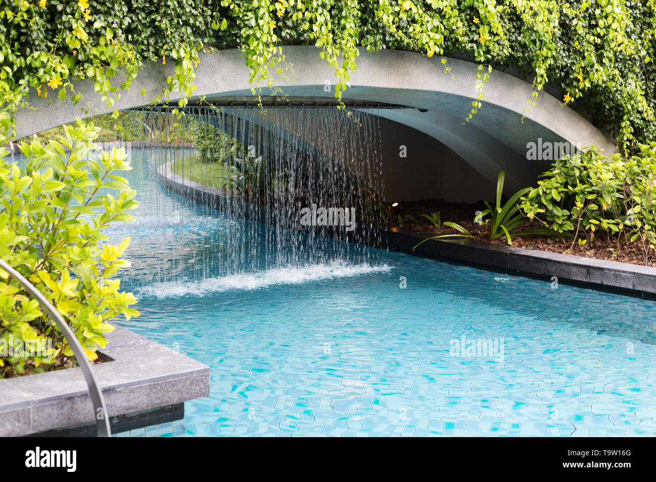 Waterfall with blue water in the pool Stock Photo - Alamy