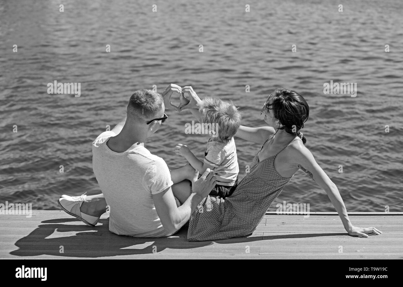 Love and trust as family values. love of happy family shape heart of ...