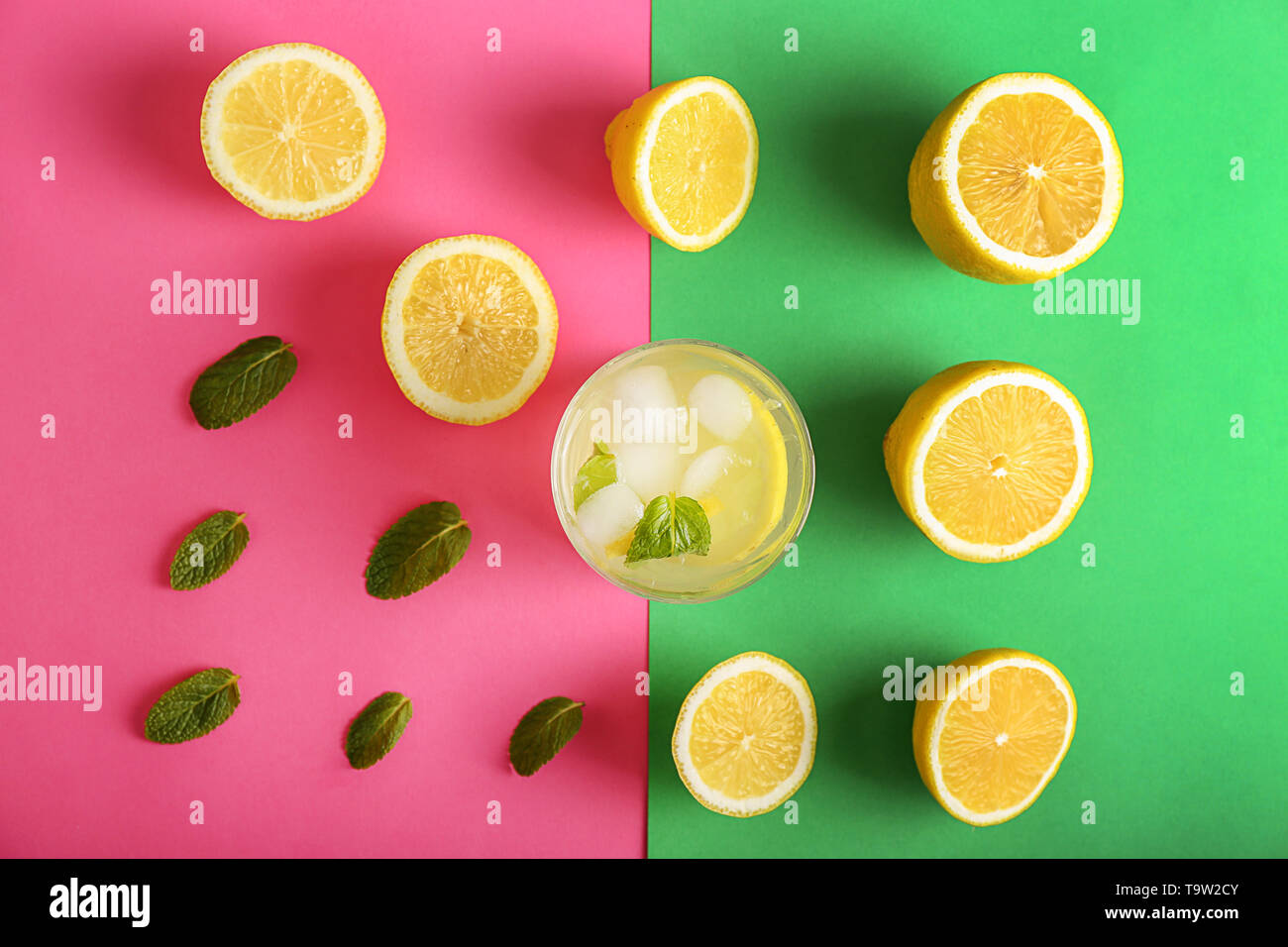 Composition with tasty lemonade on color background Stock Photo - Alamy