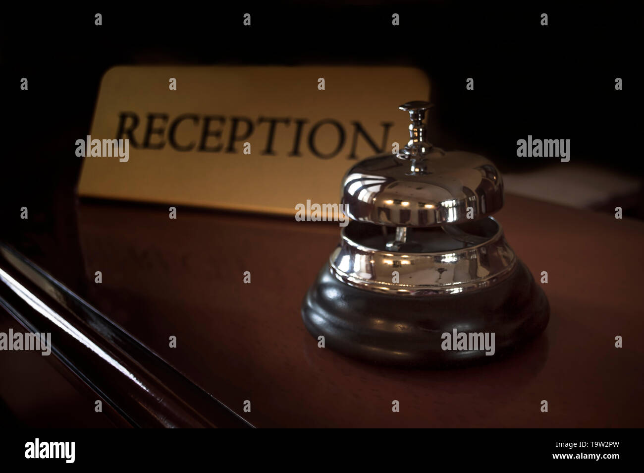 Elegant hotel service bell on the reception desk, selective focus Stock ...