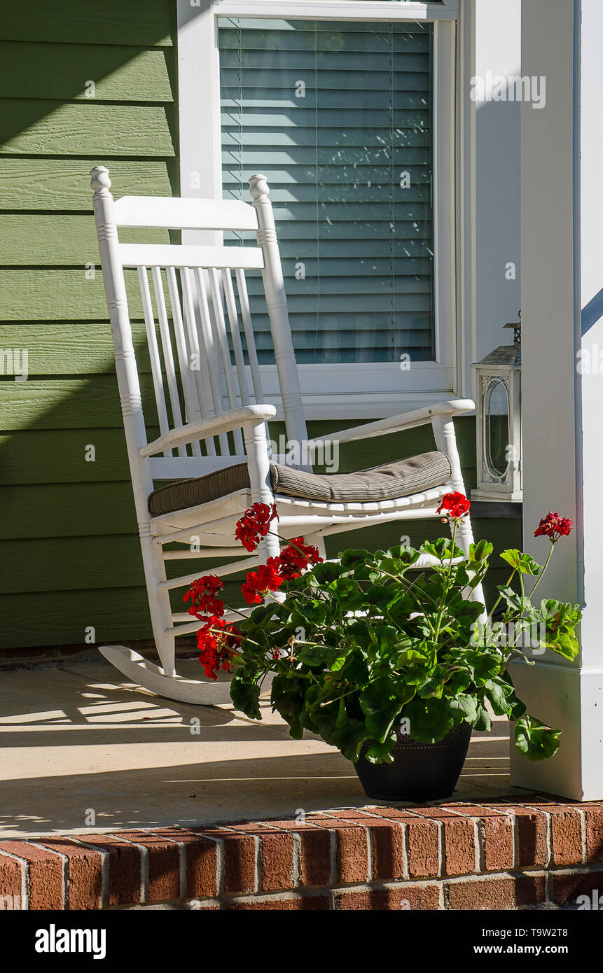 Rocking Chair and Geraniums on a Front Porch Stock Photo - Alamy