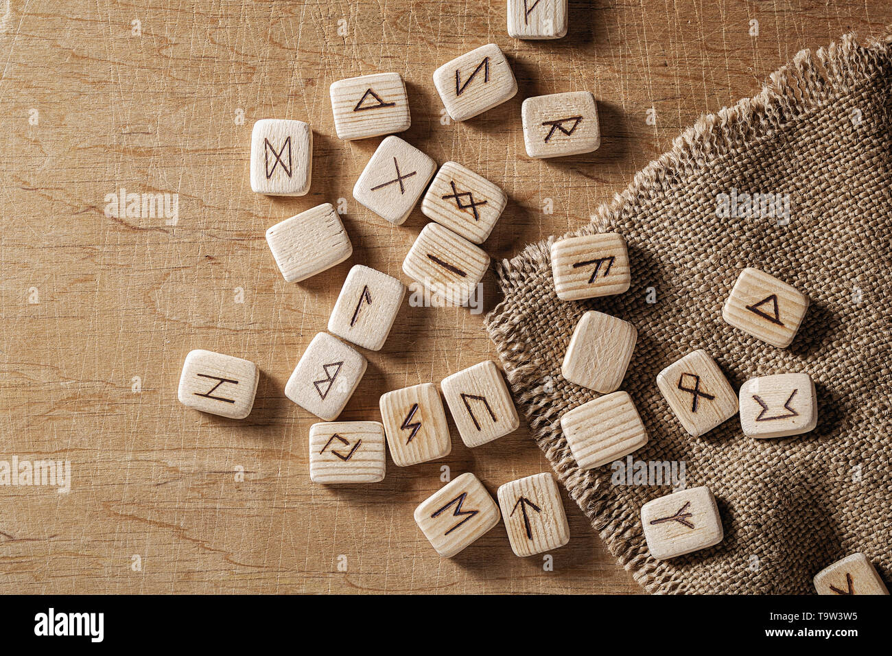 Handmade scandinavian wooden runes on a wooden vintage background ...