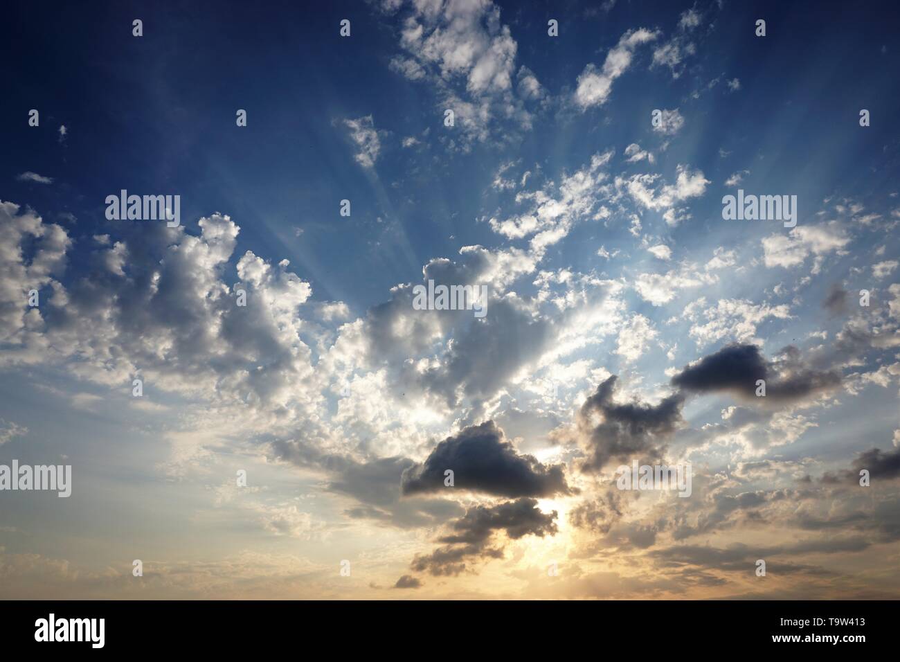 Cloudy blue sky before sunset Stock Photo - Alamy